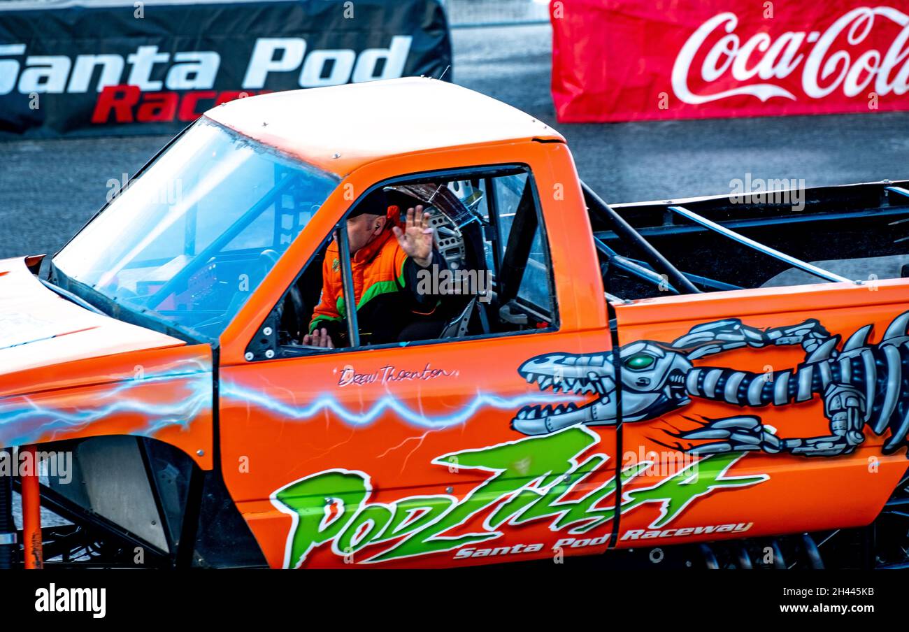 The Podzilla monster truck jumping cars during a live performance at ...