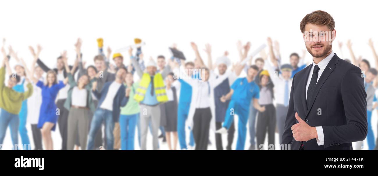 Businessman with thumb up in front of crowd of different industries ...