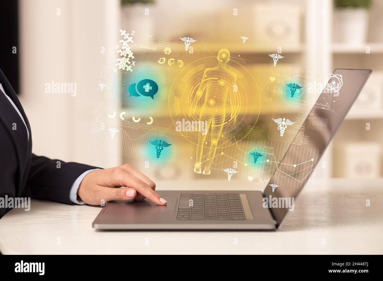 Doctor working on laptop with healthcare concept Stock Photo - Alamy