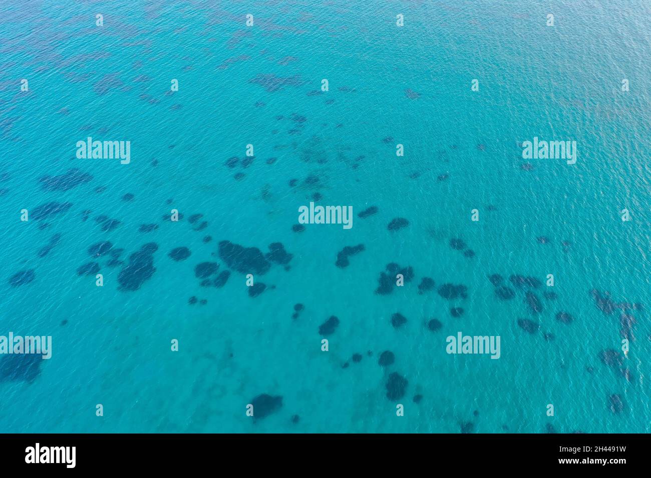 Aerial photo of turquoise sea and reef of Louros beach in West Greece ...
