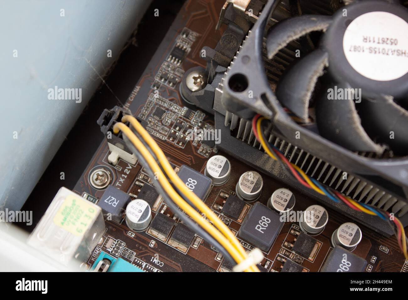 Man hand putting electrical connections of a computer in right sockets ...