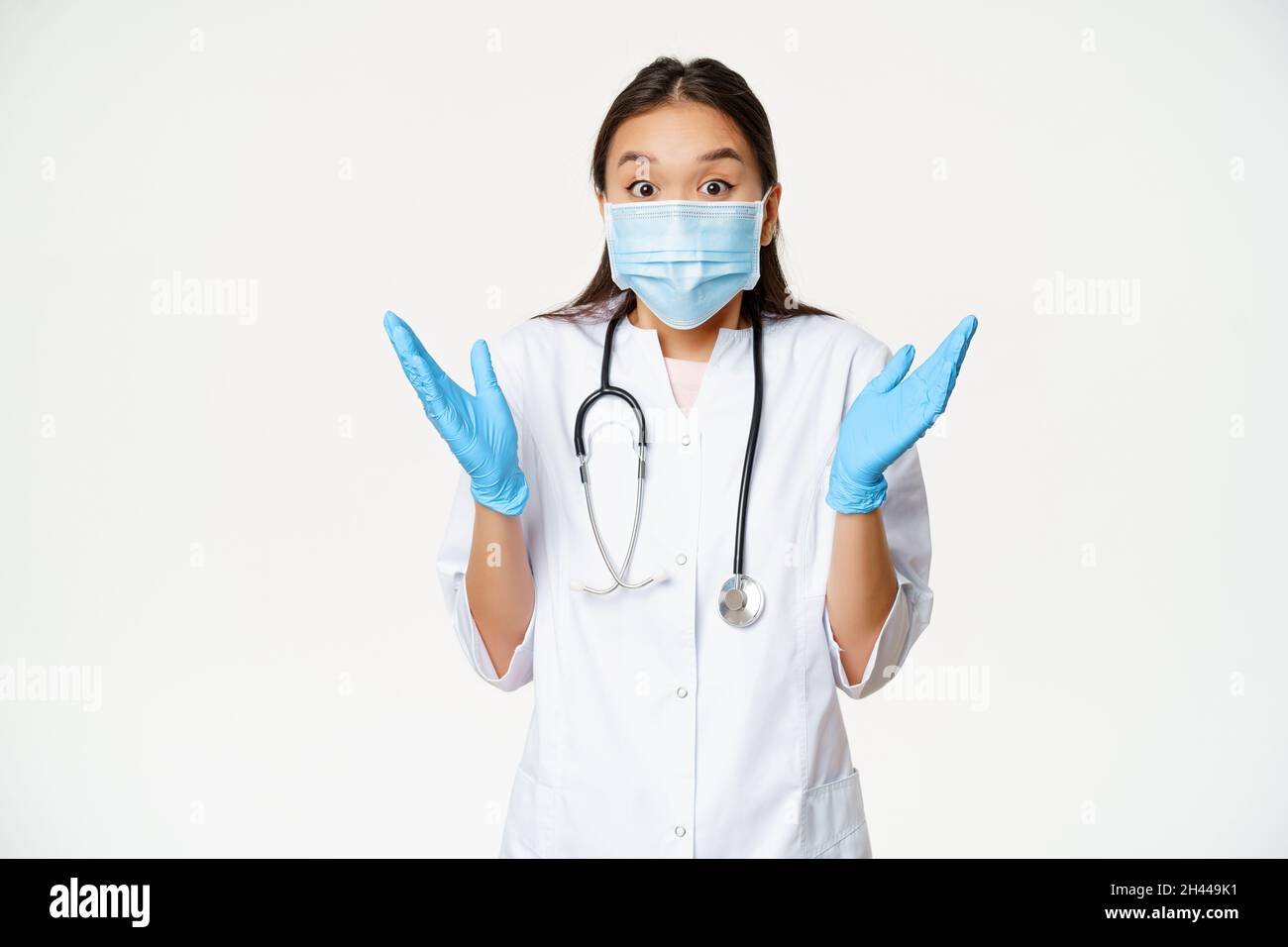 Portrait of happy asian female doctor clap hands, looking enthusiastic ...