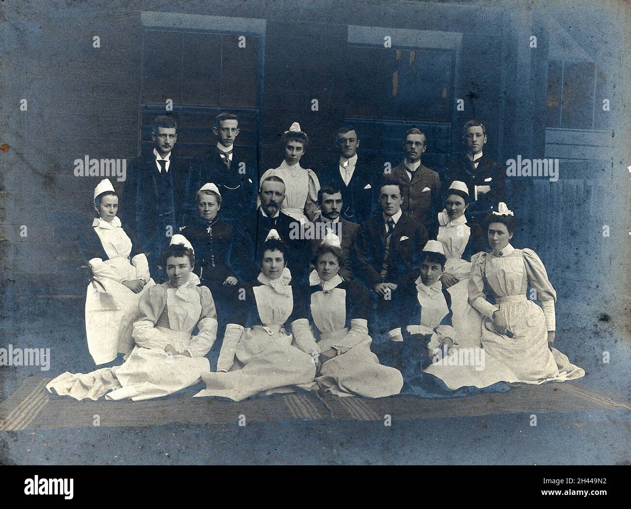 James Rutherford Morison with his staff: seven men and nine women ...