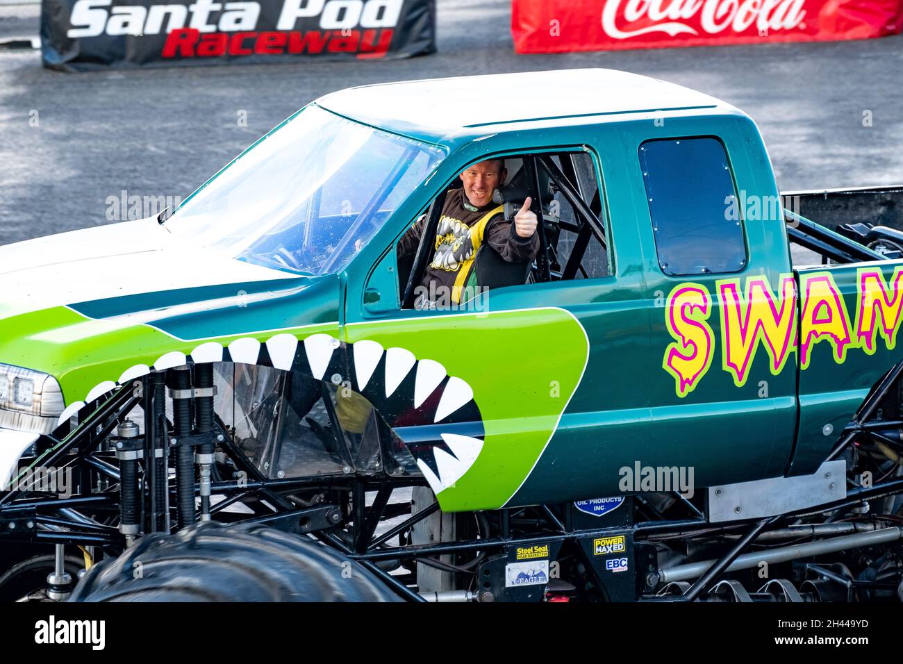 Swamp Thing monster truck crushing and jumping over cars at the Flame ...