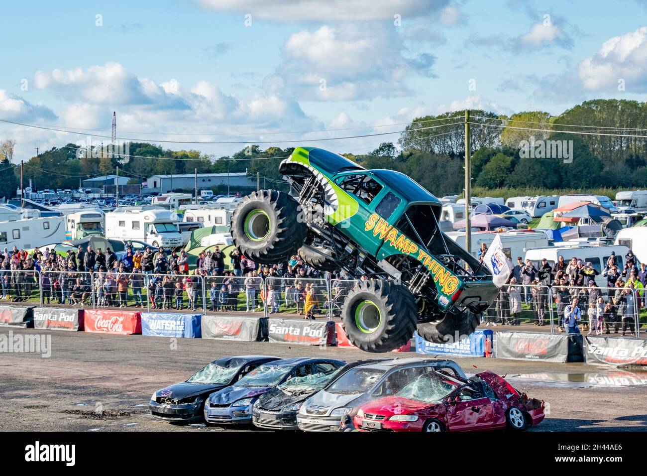 Swamp Thing monster truck crushing and jumping over cars at the Flame ...