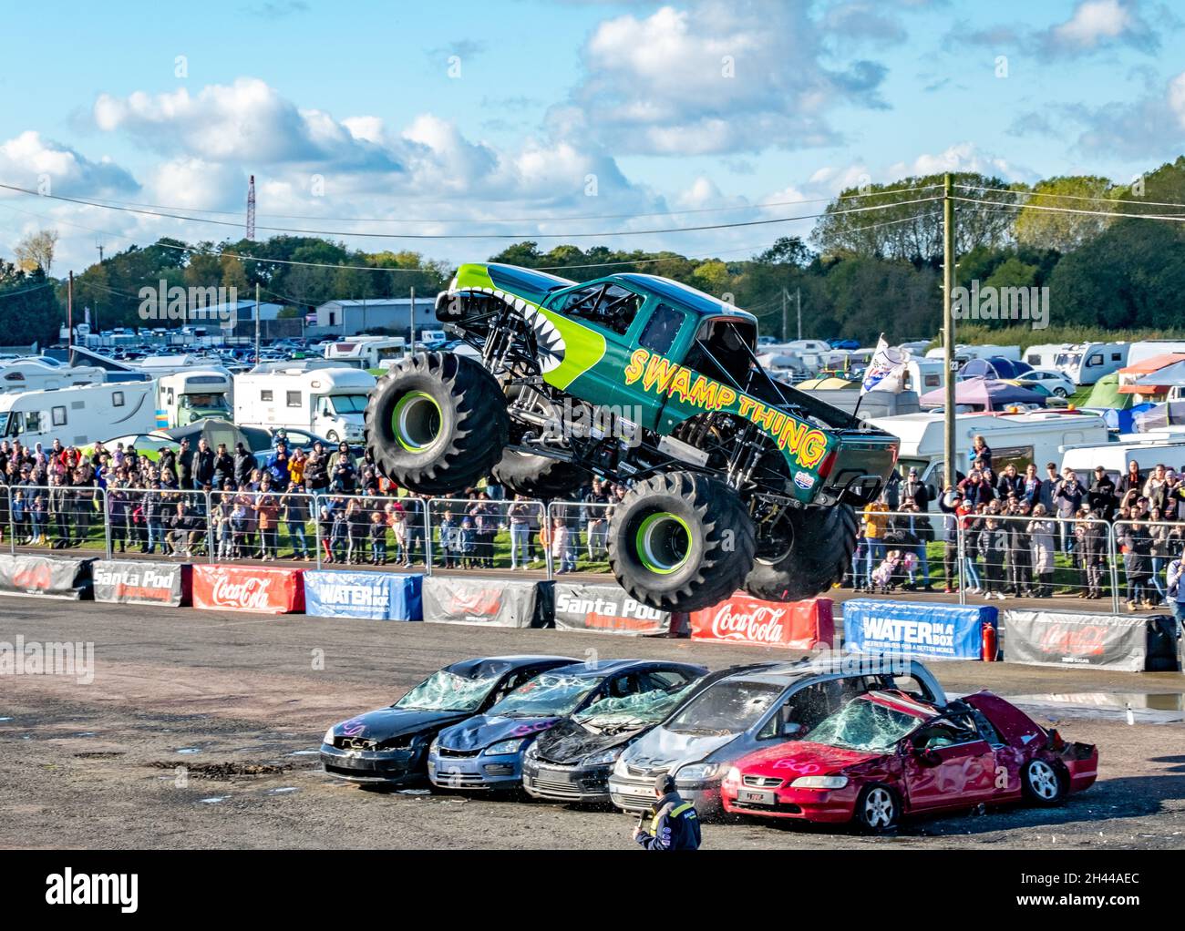 Swamp Thing monster truck crushing and jumping over cars at the Flame ...