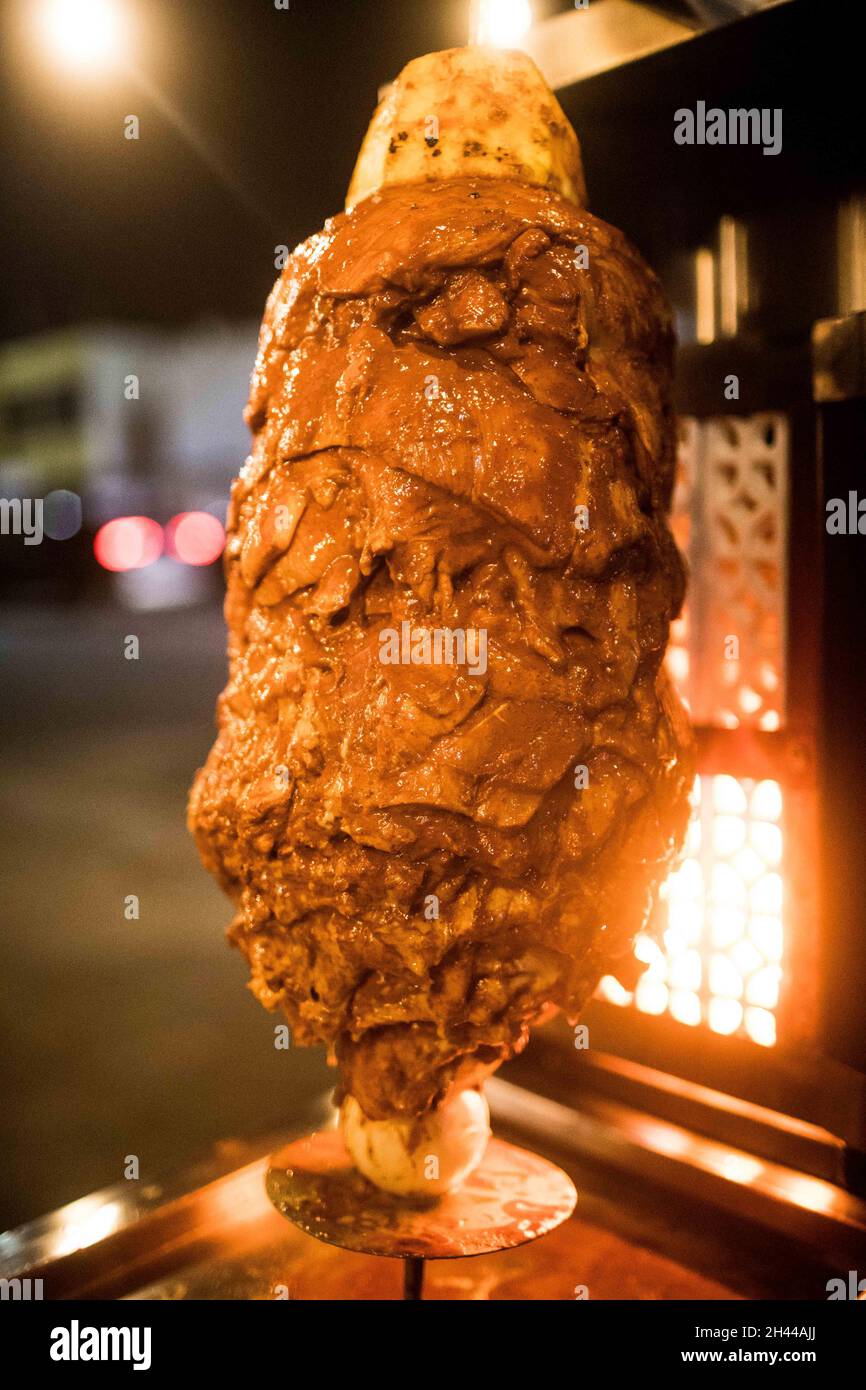 Detail of a top of adobada beef or carne al pastor at a banquet stall ...