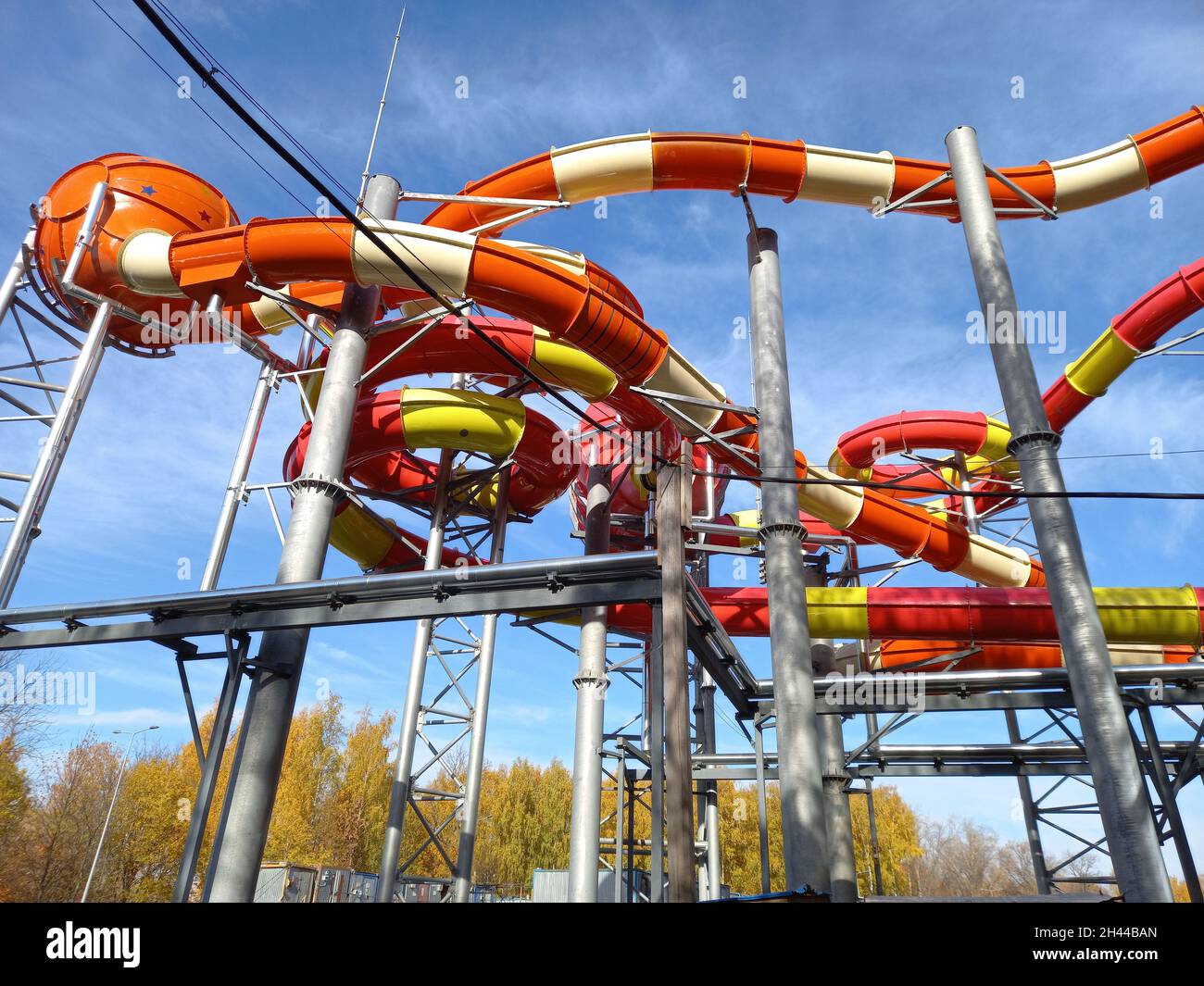 Water slide in the park in the open air. Water park, attraction. High ...