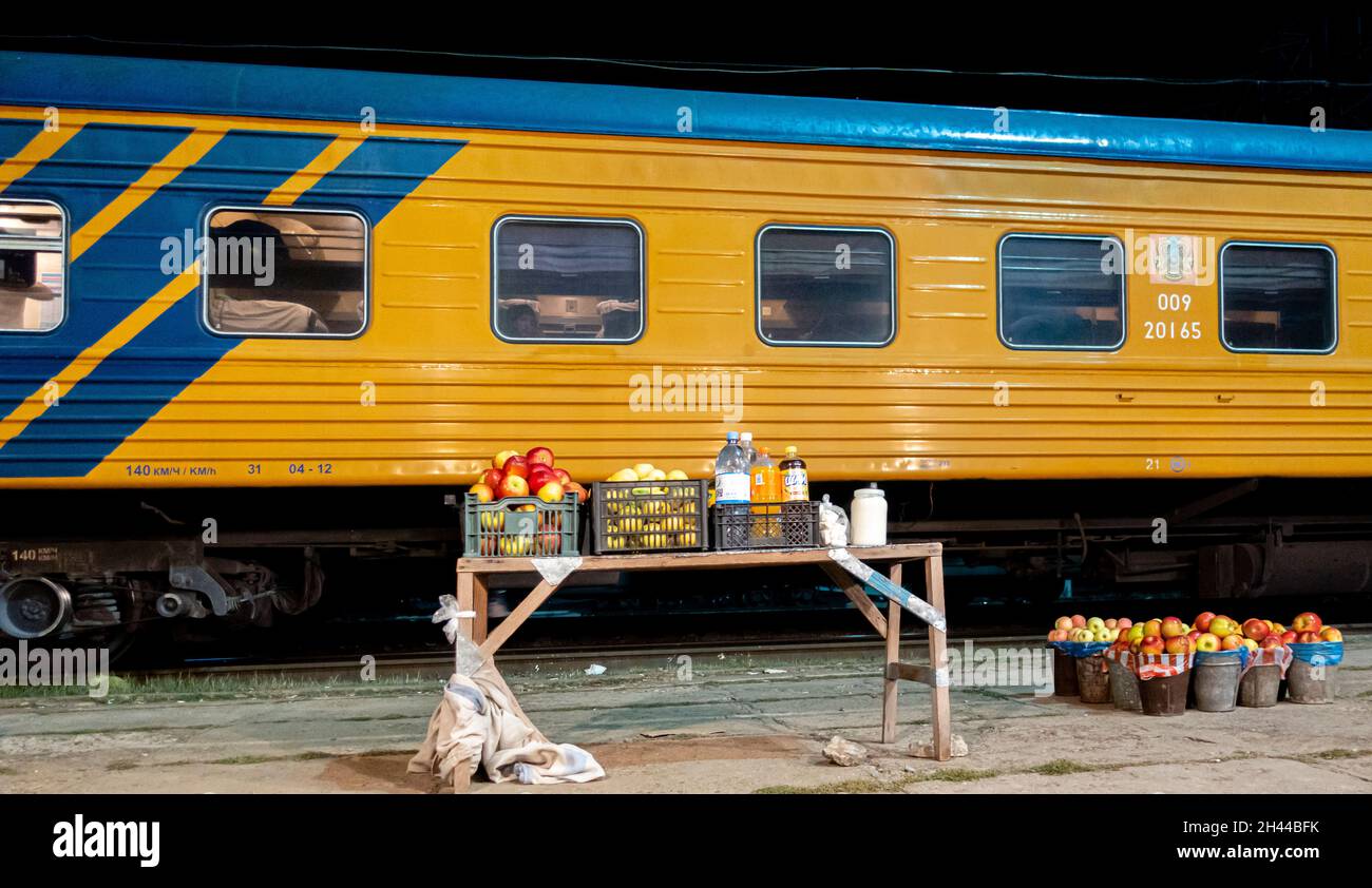 Stall and buckets with apples, drinking water beside the 3rd class ...