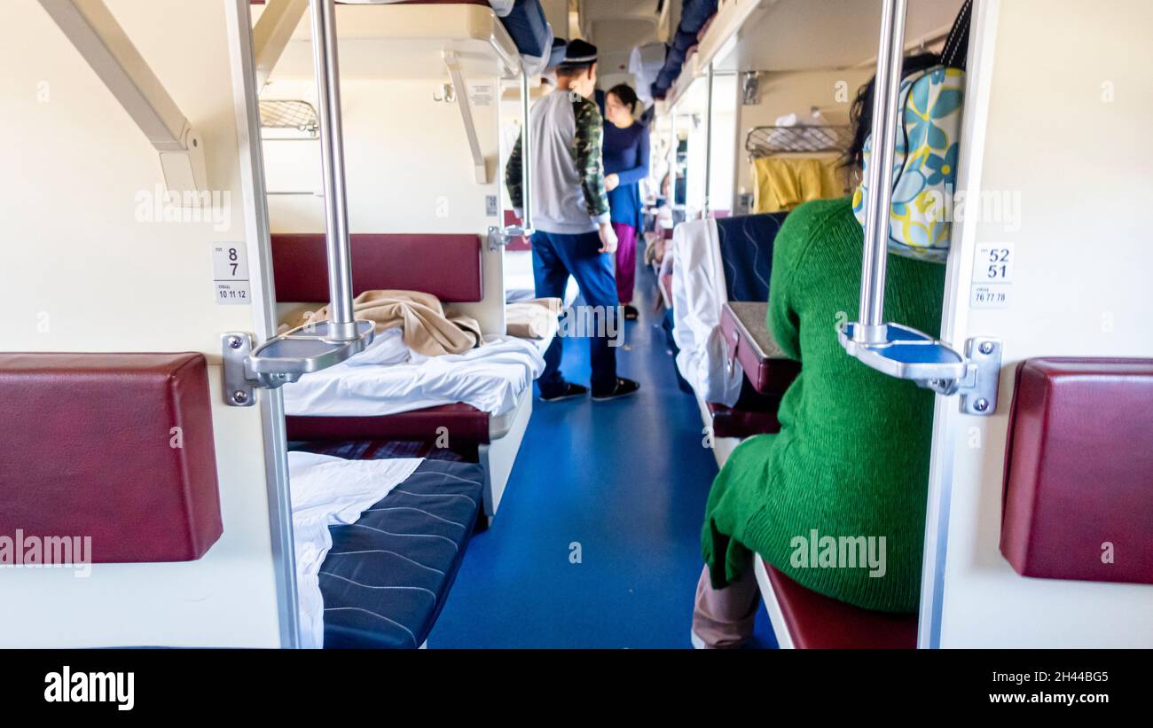 Passengers in the 3 class car, platzcart carriage in the train operated ...
