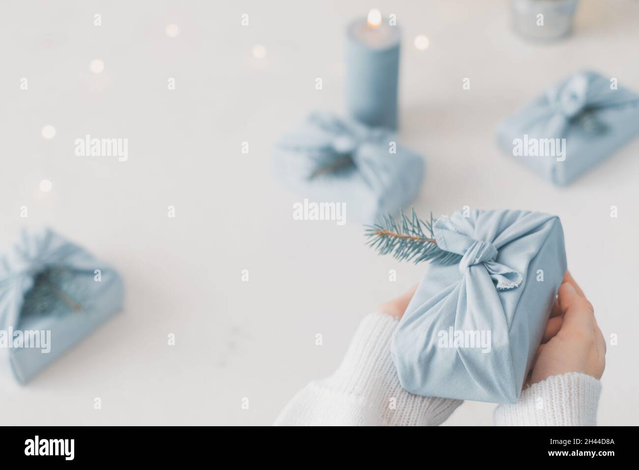 Female hands holding Christmas gift box. Christmas and zero waste ...
