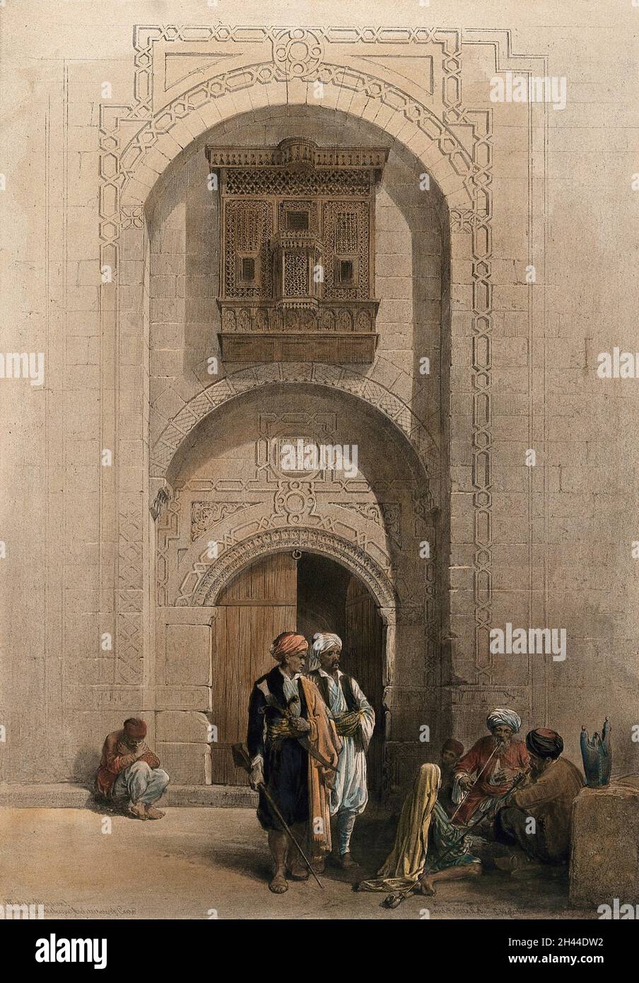 Doorway to an Arabian mansion, with men smoking outside, Cairo, Egypt ...