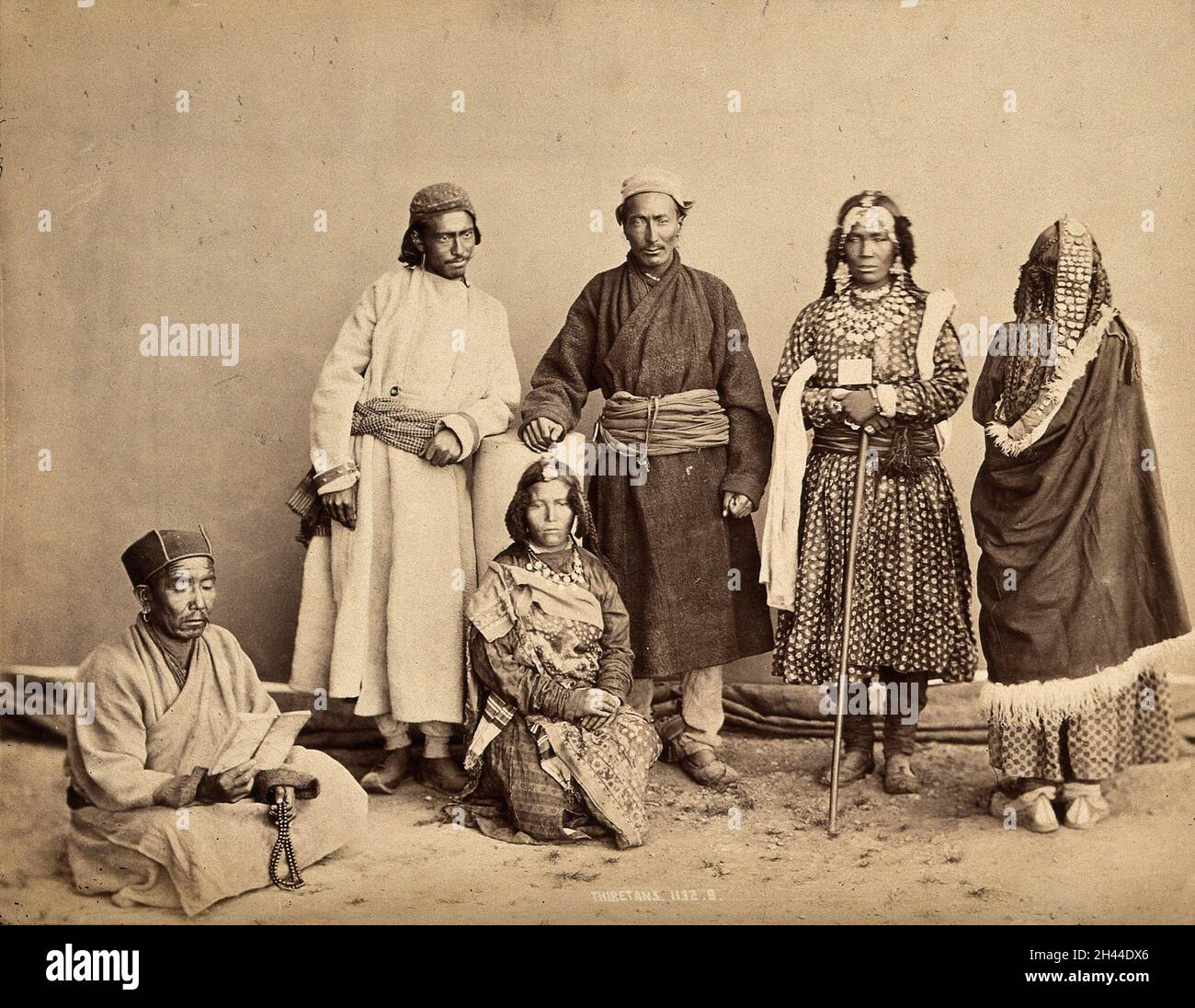 Tibetan men and women in traditional dress. Photograph, ca. 1900 Stock ...