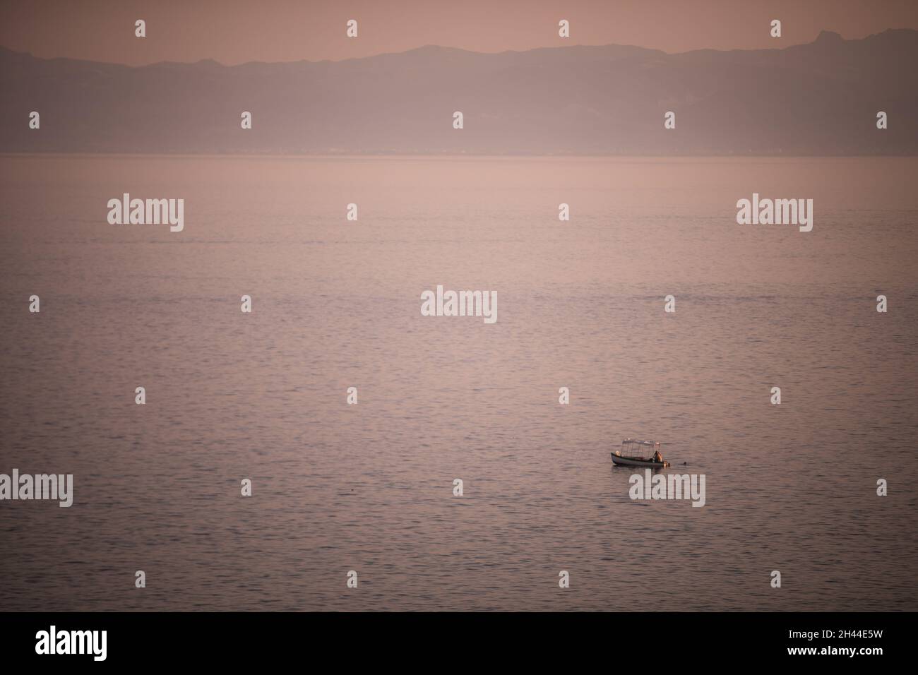 High angle image of a empty wooden boat floating on water Stock Photo ...