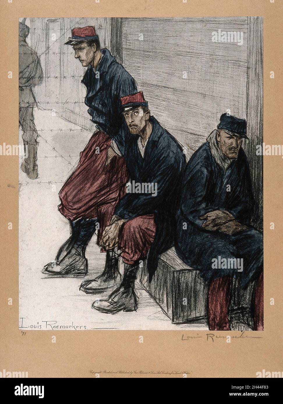 World War One: three French prisoners of war slouching in a prison yard ...