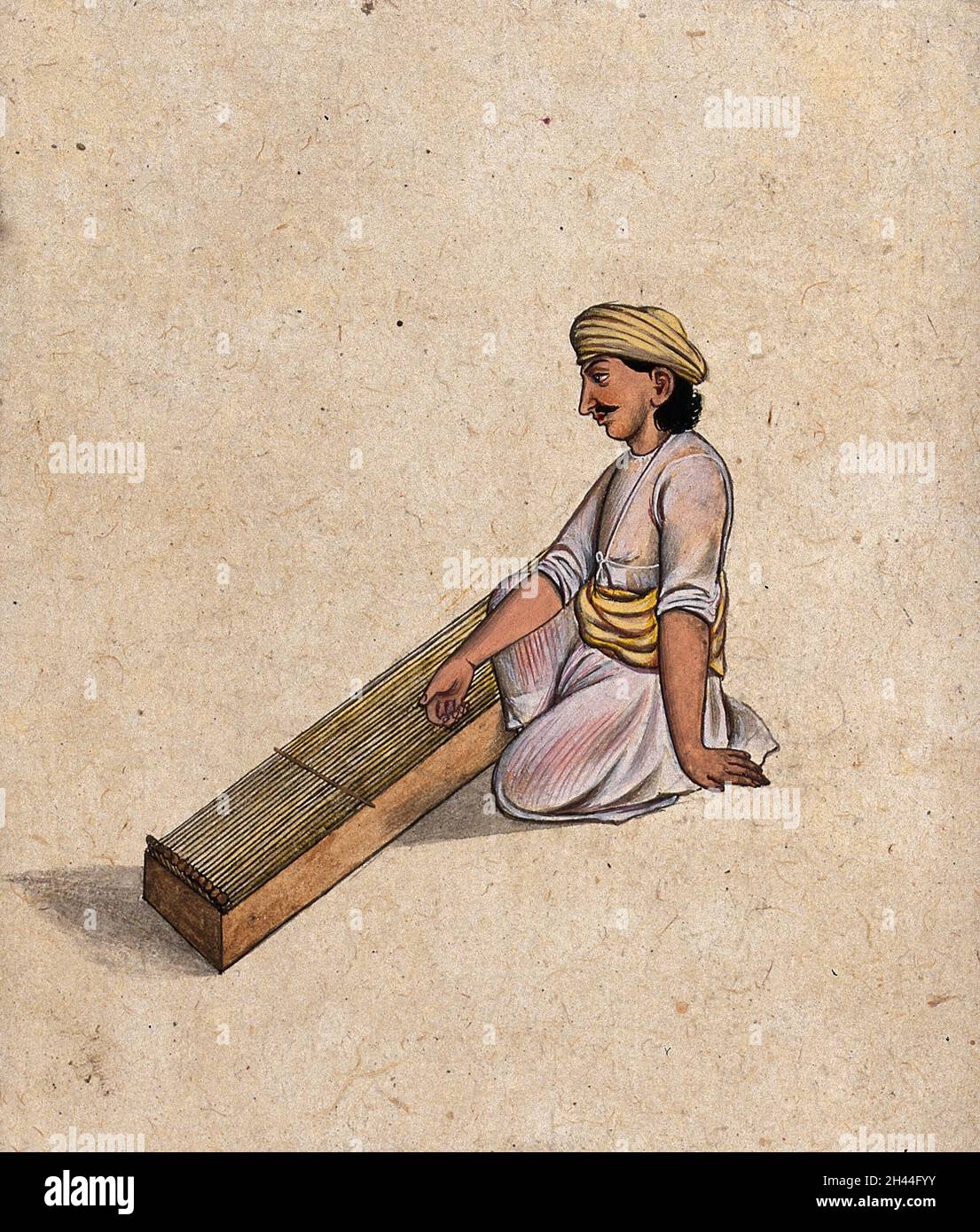 An Indian musician playing a string instrument. Gouache painting by an ...