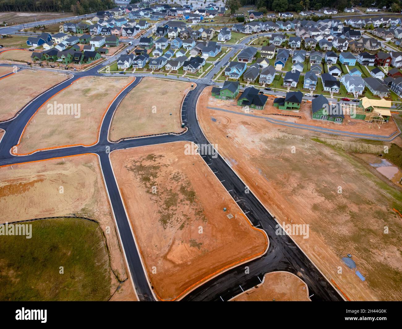 Aerial view of new development and home construction in multiple stages ...