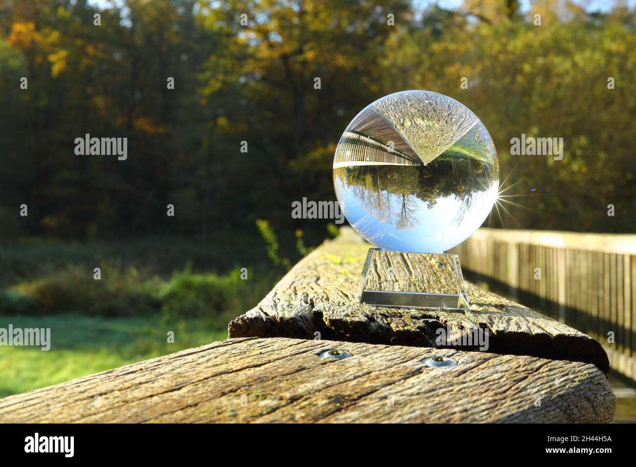 scenic view of the wooden railing through a crystal ball Stock Photo ...