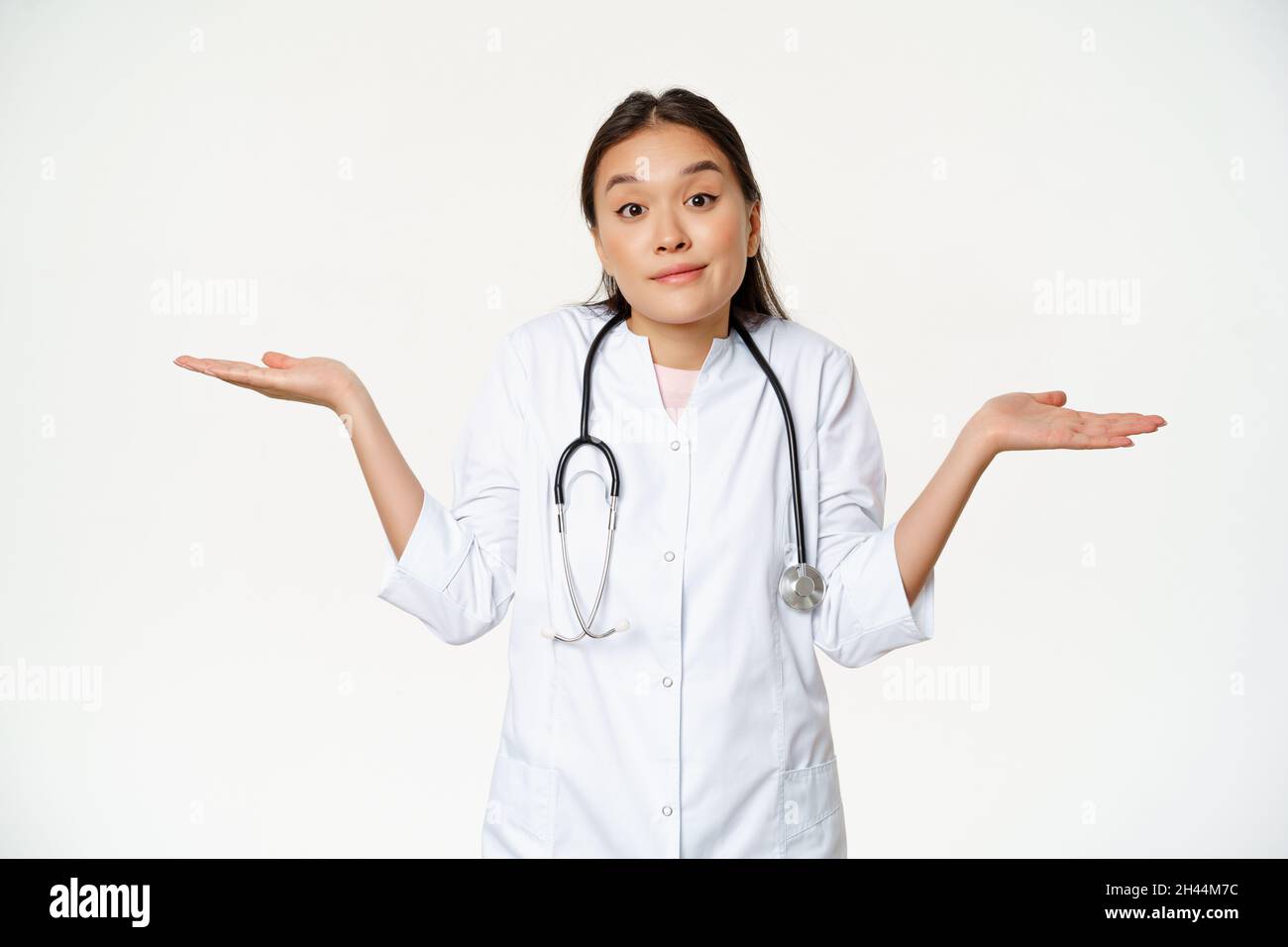 Dont know. Clueless female asian doctor shrugging, spread hands ...