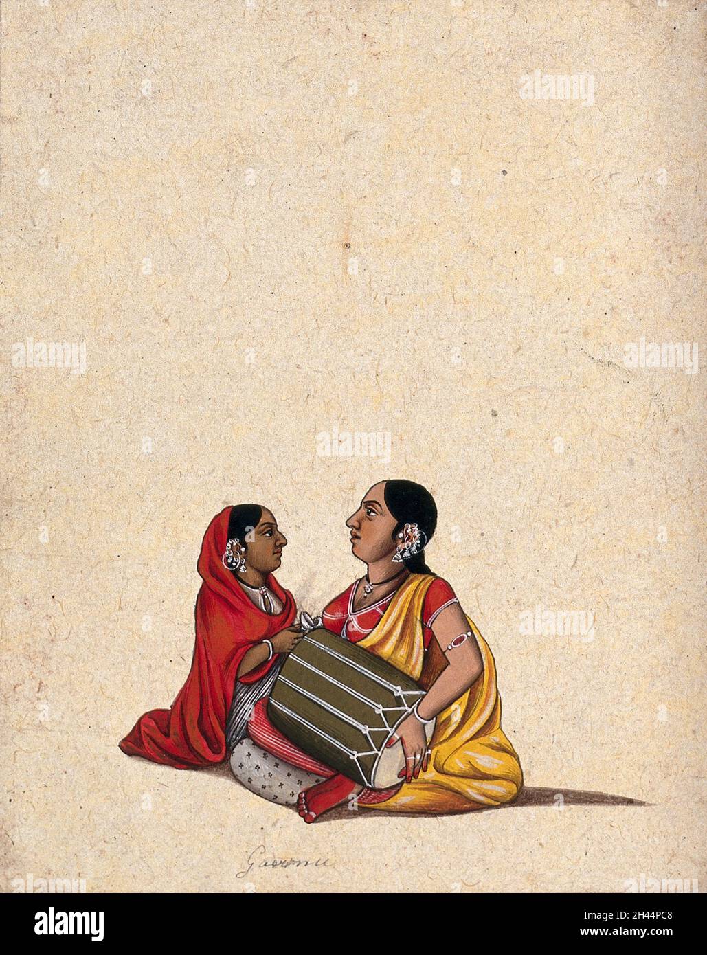 Two women playing the dholak (Indian drum) and cymbals. Gouache ...