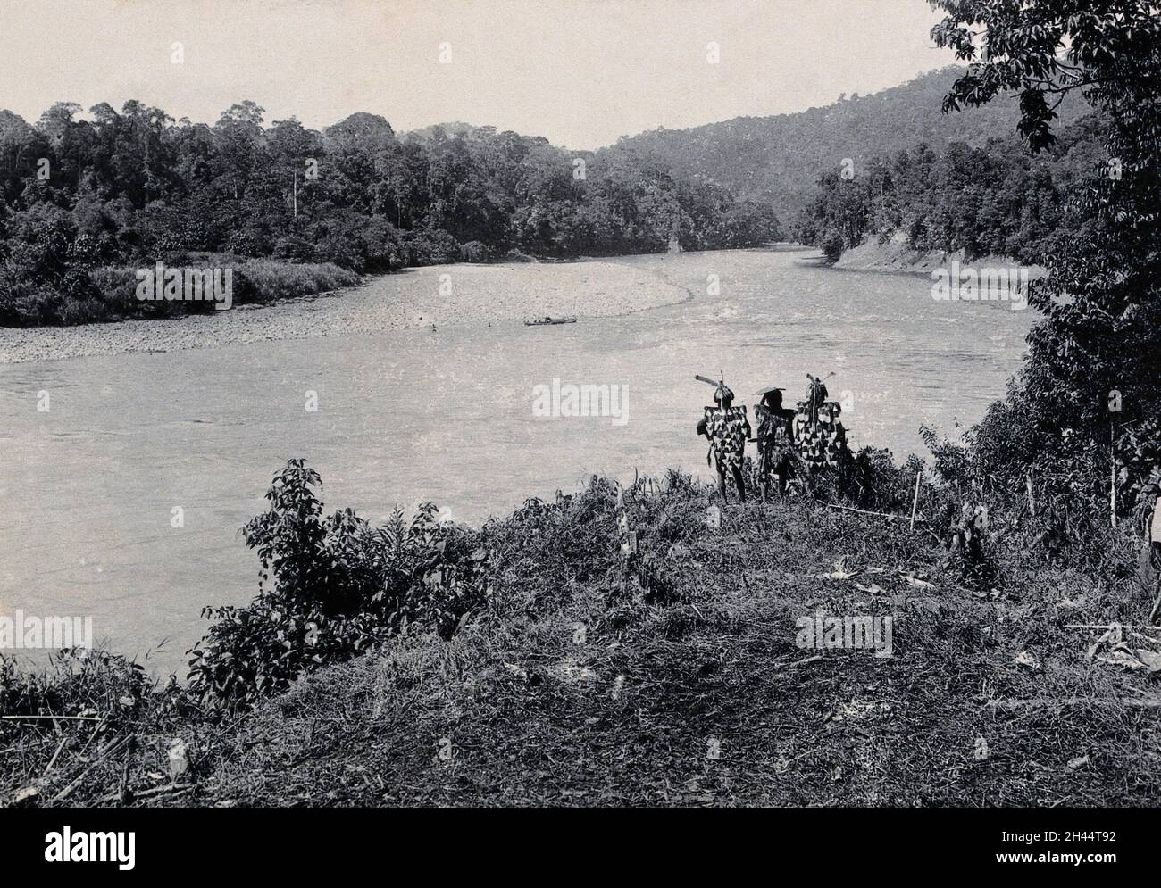 Sarawak: three men standing by the Baram River. Photograph Stock Photo ...