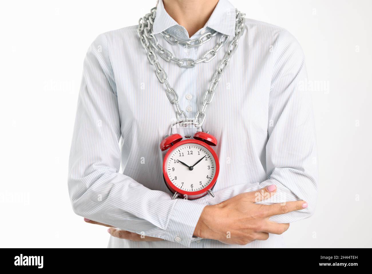 Chain with red alarm clock weighs on woman neck Stock Photo - Alamy