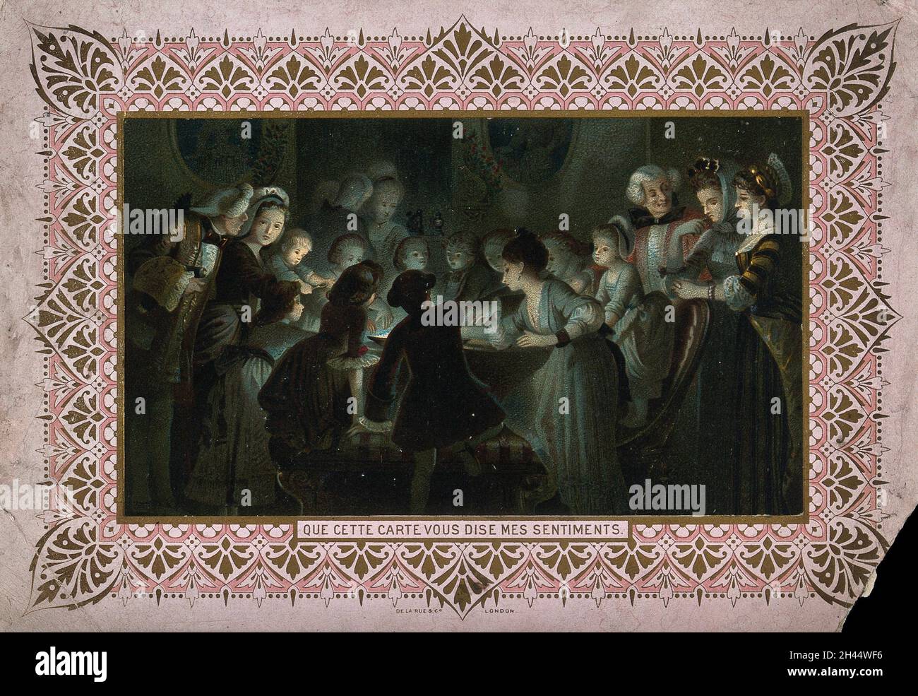 Men, women and children are crowding round a table reaching towards a ...