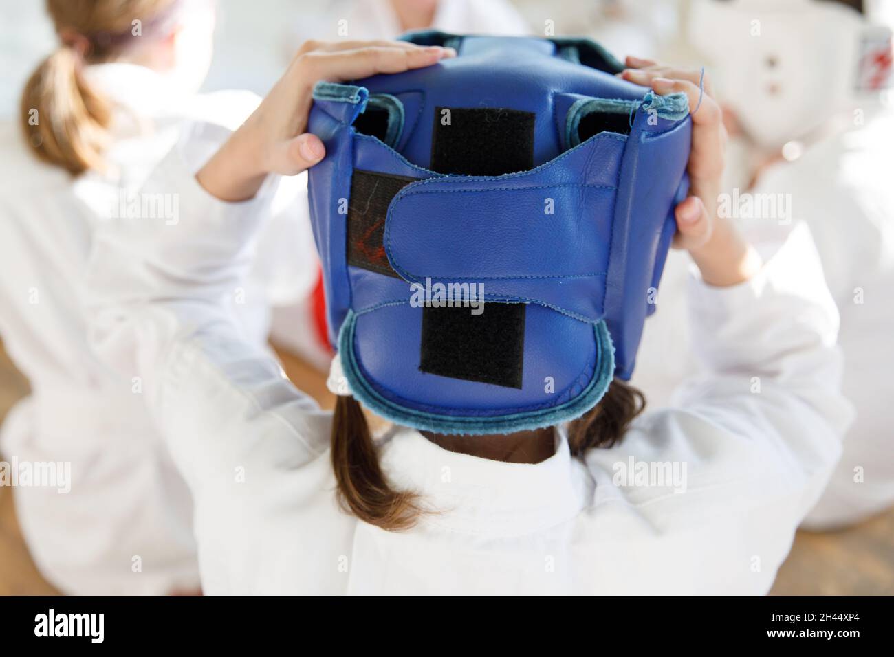Karate students train in the martial arts hall. Martial arts school ...