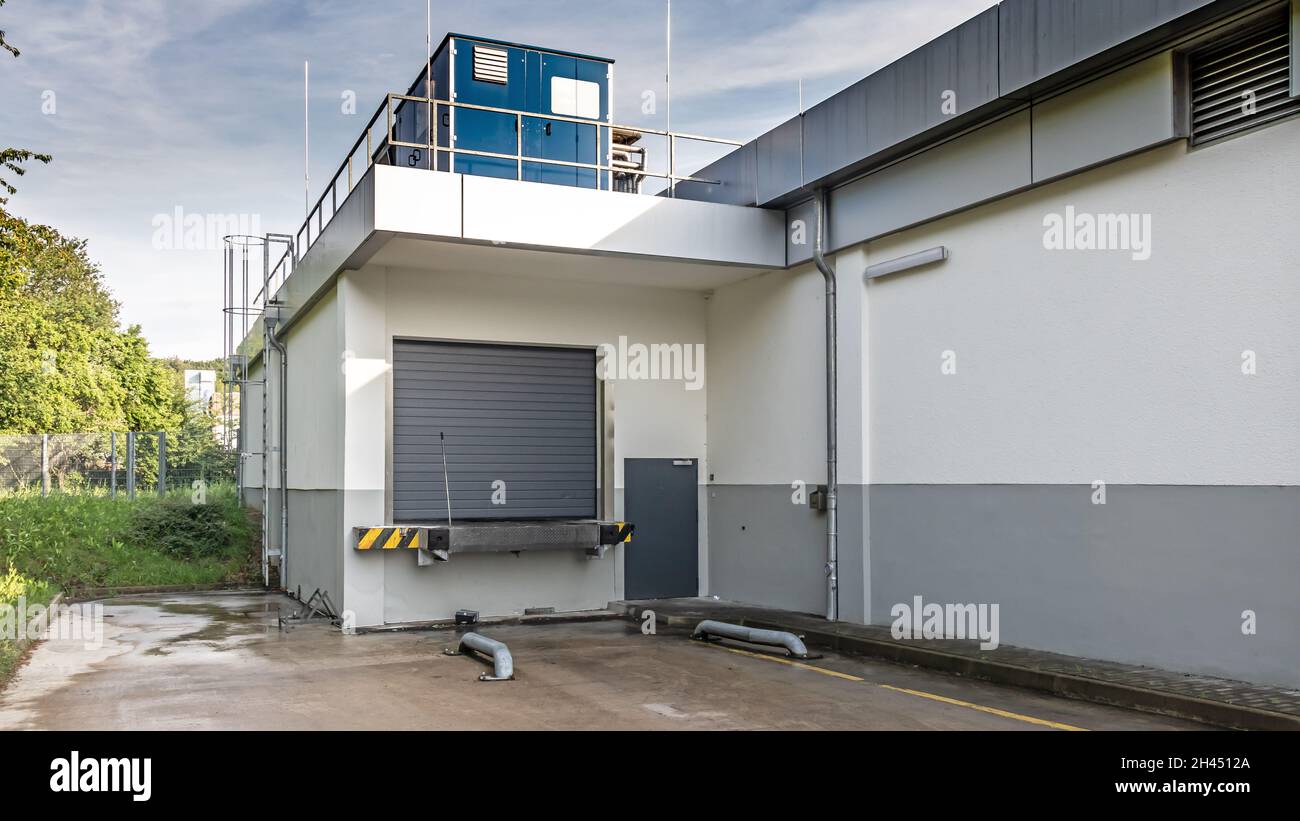 Loading ramp for trucks on a warehouse in a summer day Stock Photo - Alamy