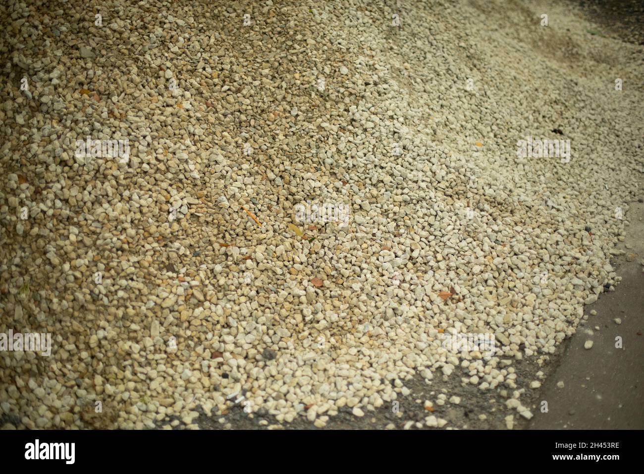 Crushed stone at the construction site. Building material gravel. Small ...