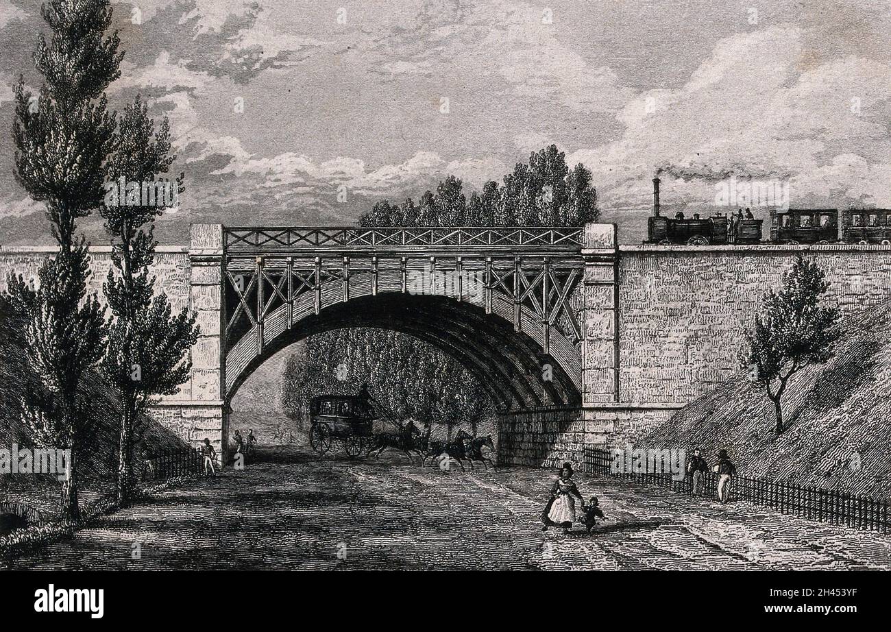 A steam train is travelling across a viaduct at Nanterre with a road, a ...