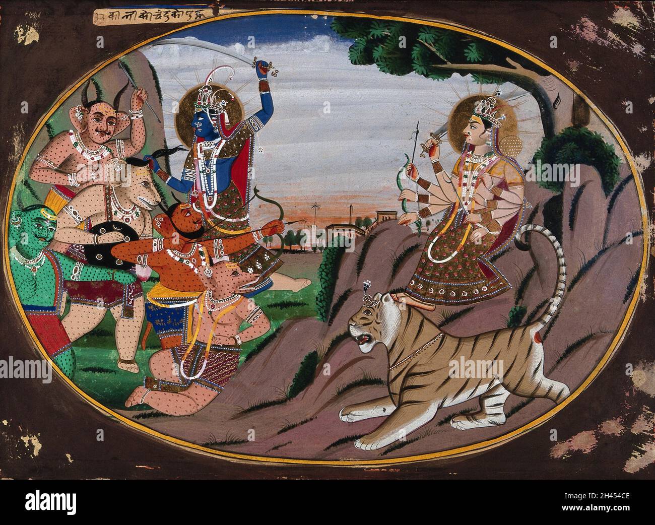An eight-armed goddess (Durga ?) standing on a tiger's head faces a ...