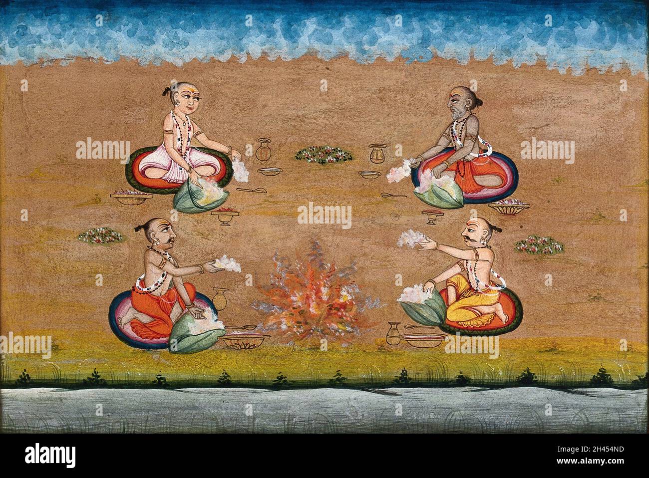Four priests perform a yagna, a fire sacrifice, an old vedic ritual ...