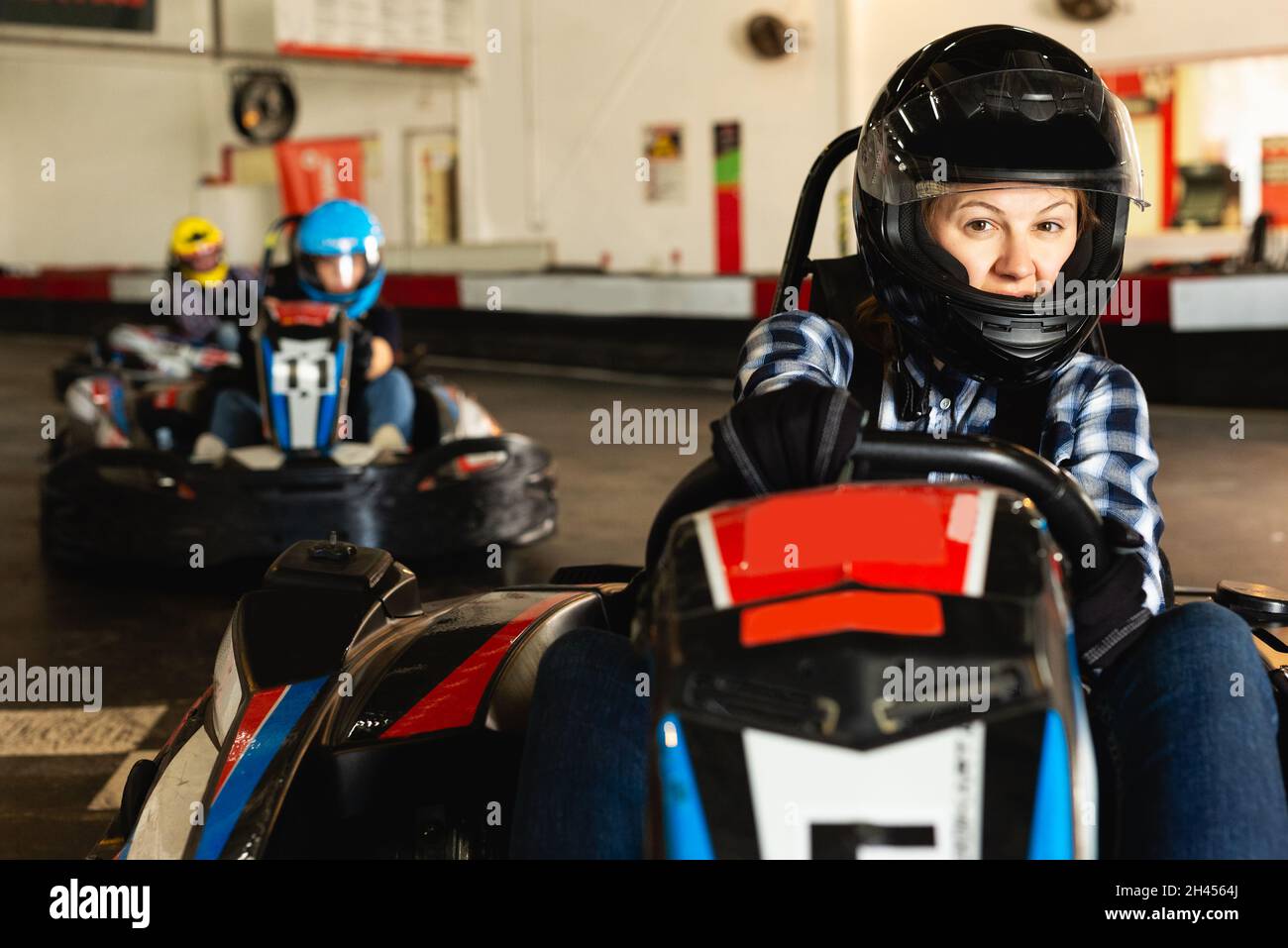 woman driving racing car at kart circuit Stock Photo - Alamy