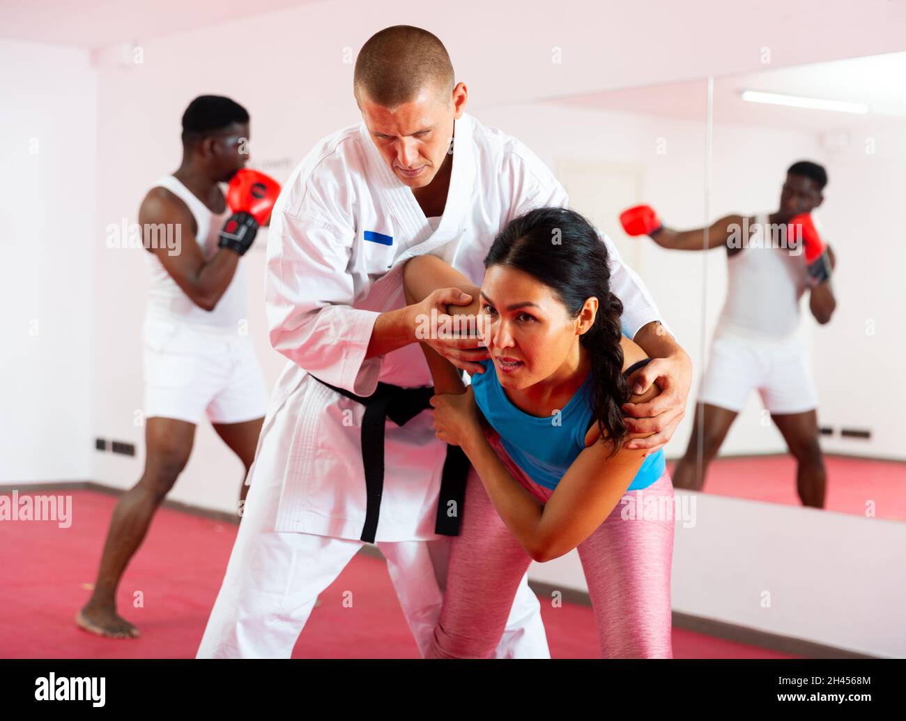 Man coaching woman boxing in hi-res stock photography and images - Alamy