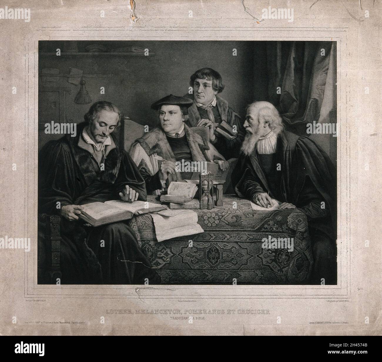 Four Protestant reformers translating the Bible. Lithograph by L. Noel ...