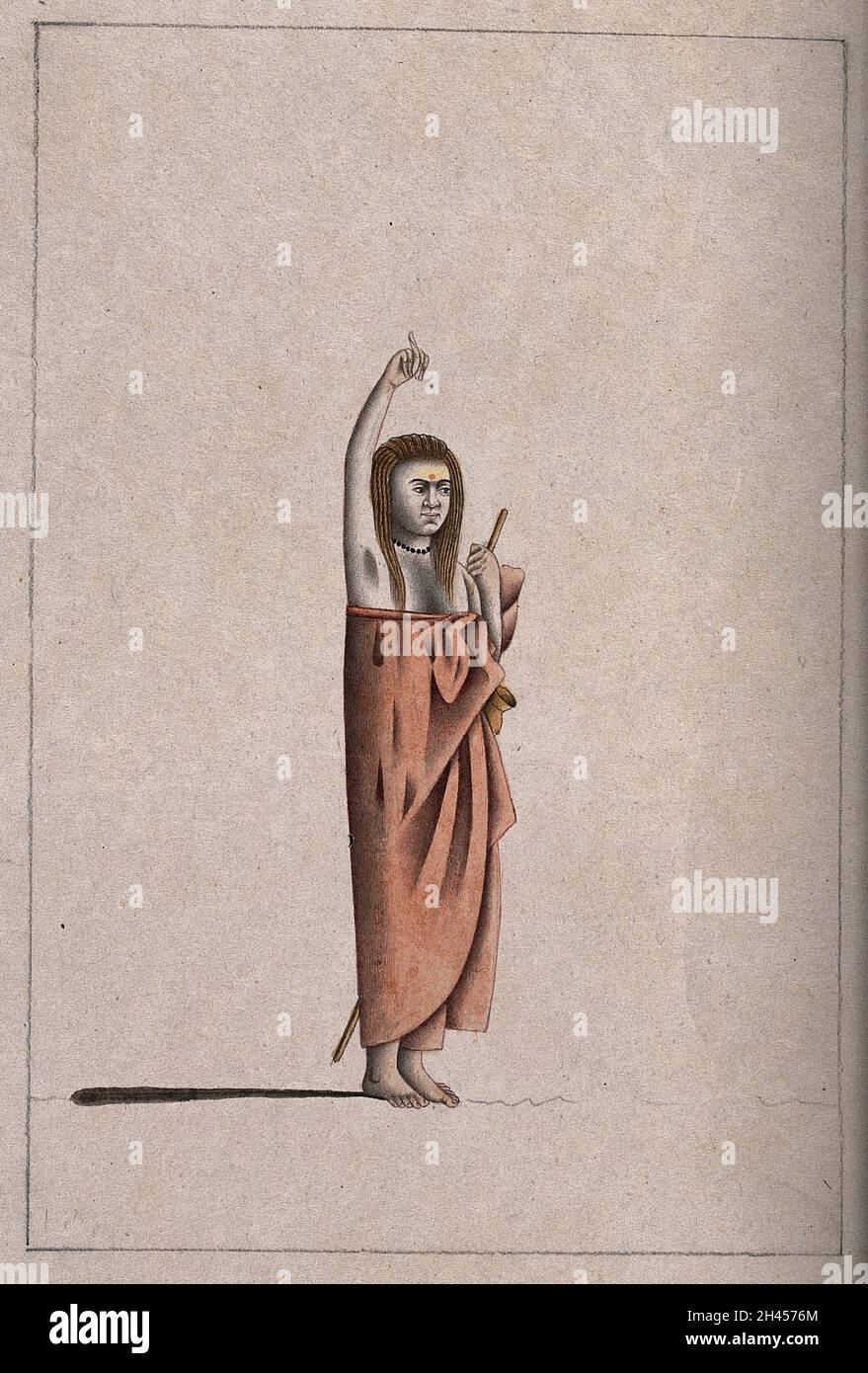 A Hindu ascetic or holy man: standing, with his right arm raised above ...