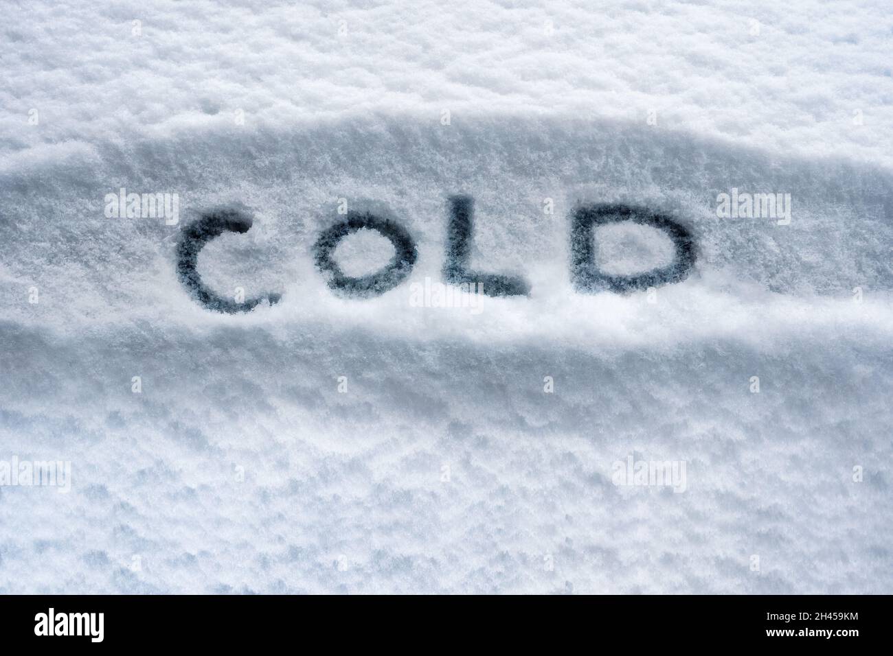 Written white snow cold weather concept. Written word COLD symbol ... Written white snow cold weather concept. Written word COLD symbol ...