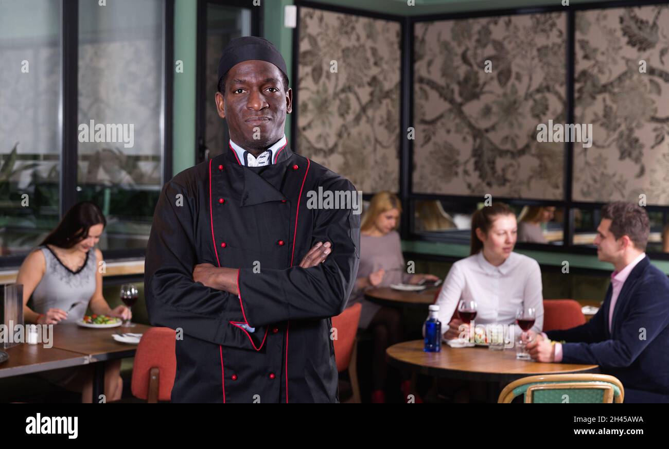Portrait of confident African American chef with arms crossed on ...