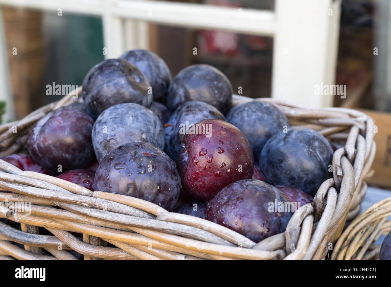 basket of Fresh raw fresh plums London Greenwich England UK Stock Photo ...