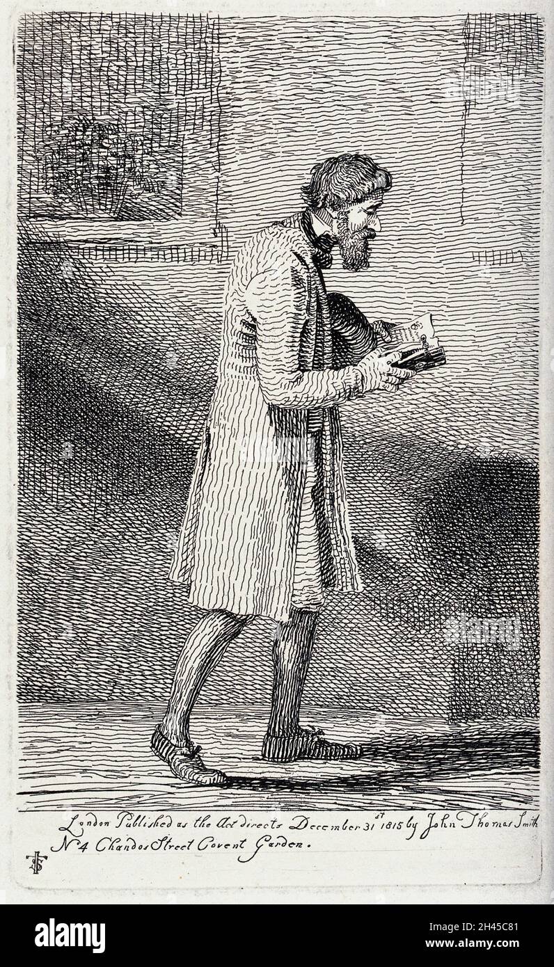 A bearded man walking the streets with his hat under his arm deeply ...