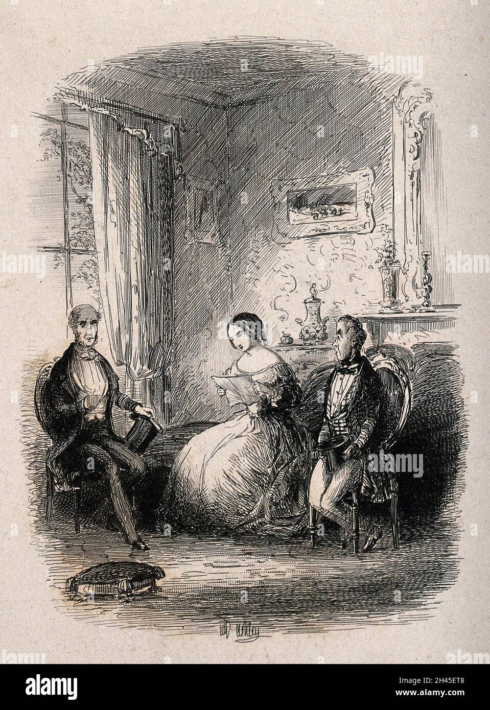 A young women sits reading a sheet of paper while one man listens ...