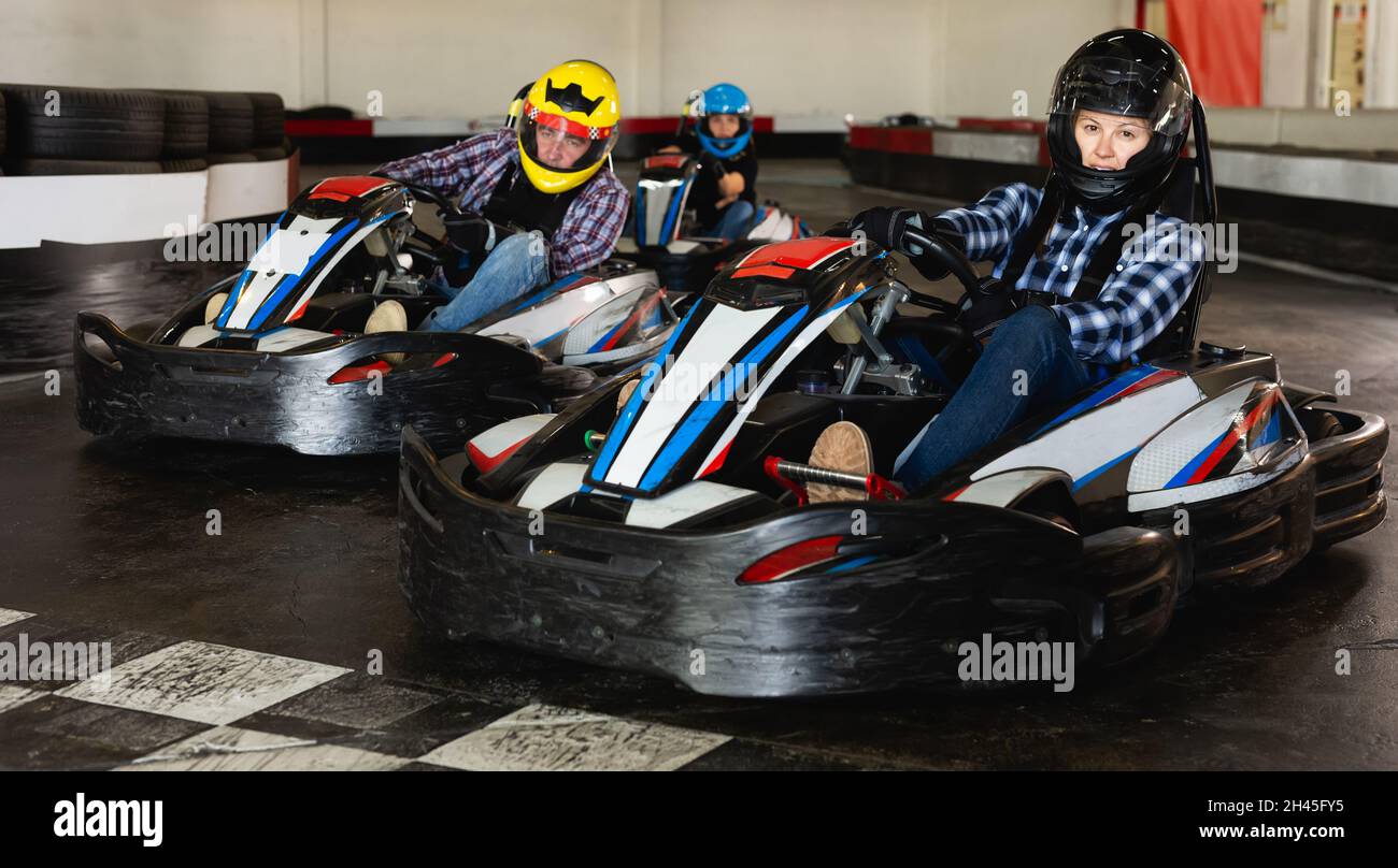 People driving go-kart cars Stock Photo - Alamy