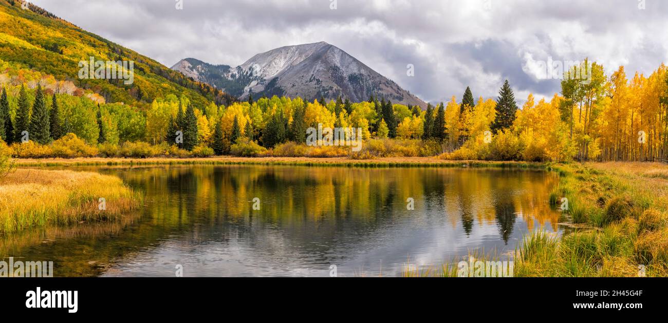 Sunlit Autumn color reflected in Warner Lake in the Manti-La Sal ...