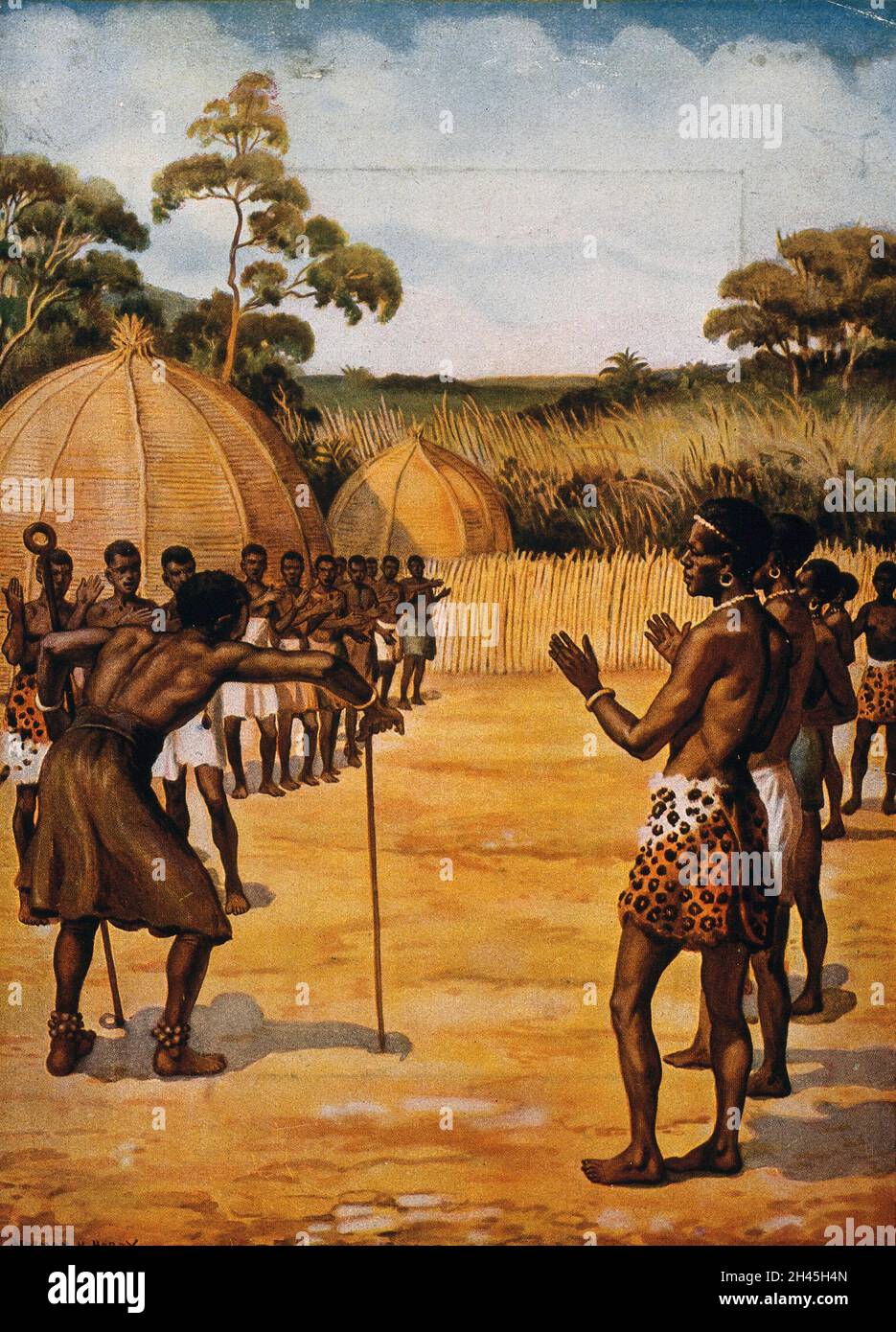 A Swazi medicine man or shaman performing a ritual in front of his ...