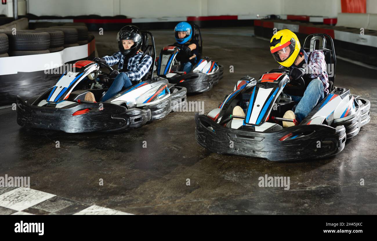 Group of happy male and females driving cars Stock Photo - Alamy