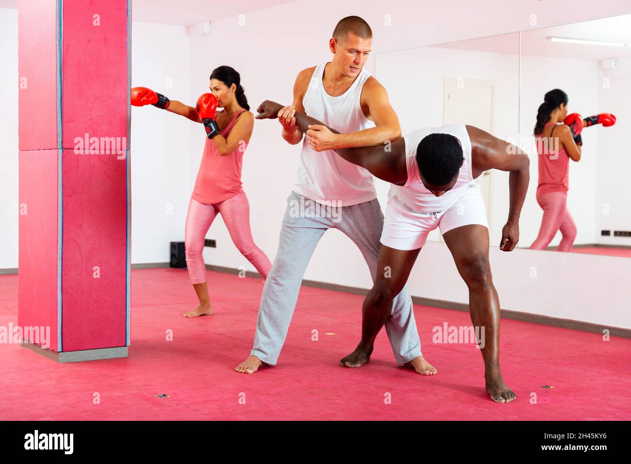 Sparring of two men at self-defense training in sports club Stock Photo ...