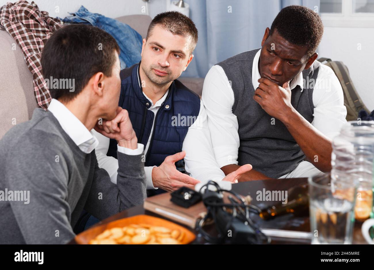 Three friends argue hi-res stock photography and images - Alamy
