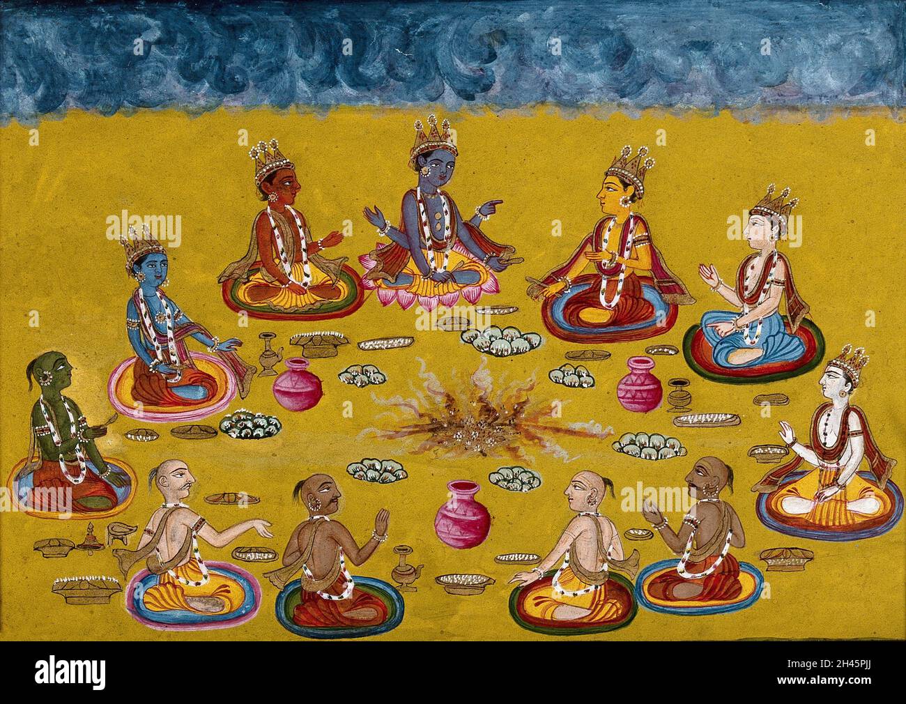 A four armed deity (?) sitting with five priests and five other deities ...