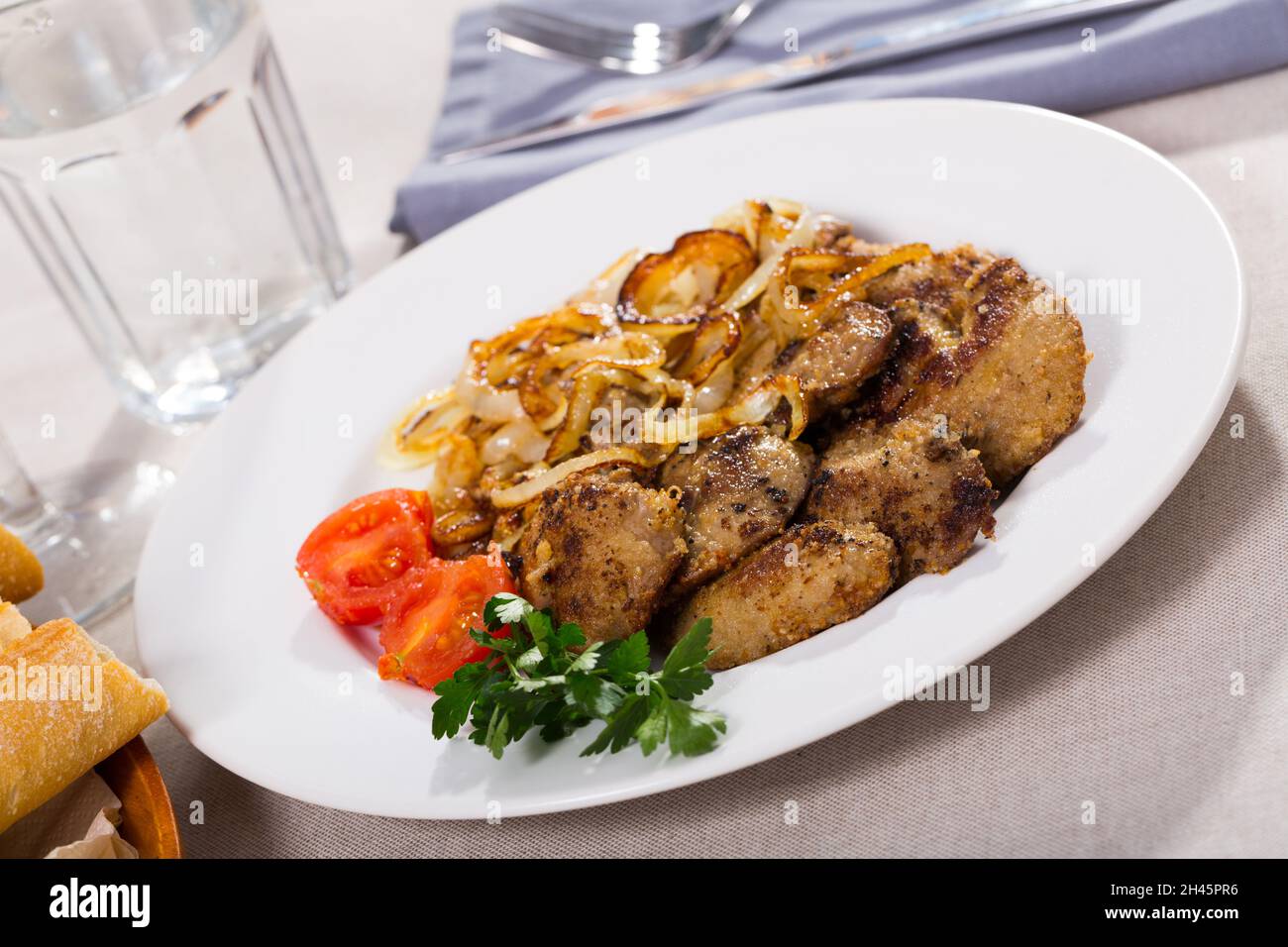 Fried rabbit liver with onion Stock Photo - Alamy